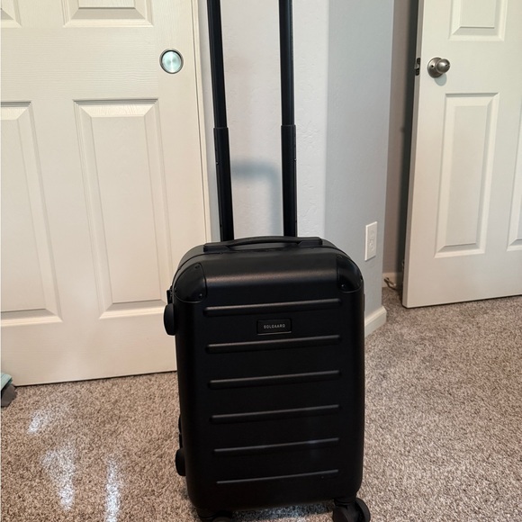 Solgaard | Bags | Solgaard Black Rolling Luggage | Poshmark